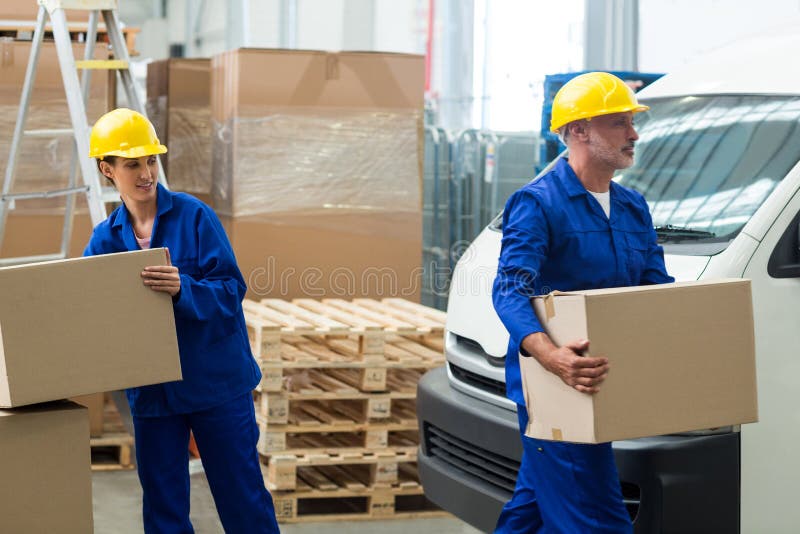 Workers carrying boxes stock image. Image of people, crate - 77696159