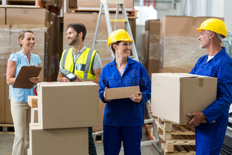 Workers carrying boxes stock image. Image of horizontal - 77696217