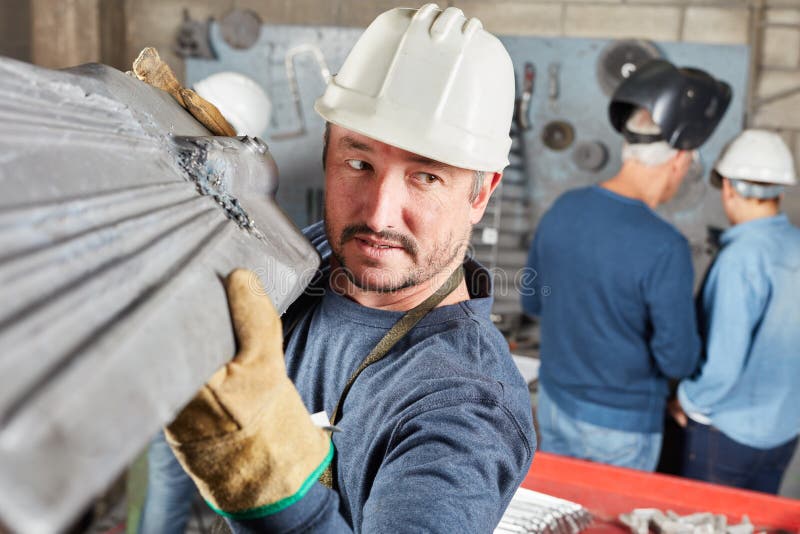 Workers Carrying Loads in Workshop Stock Photo - Image of factory ...