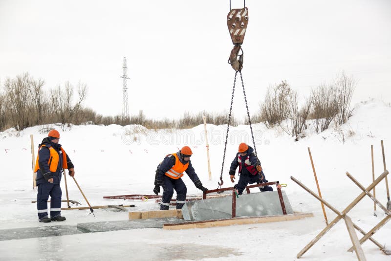 Workers Rafting Ice Blocks Along a Channel Cut Out by a Frozen Lake ...