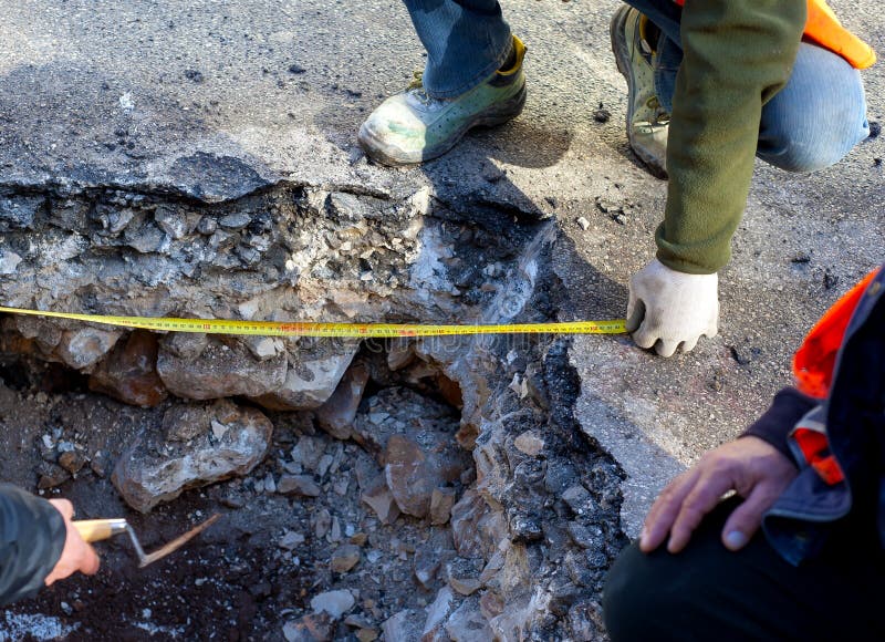 Workers Check a Tape Measure the Width of Excavation Stock Image ...