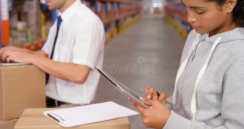 Workers Checking Boxes with Clipboard and Tablet Computer Stock Footage ...