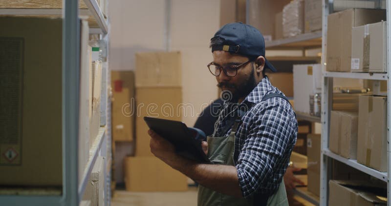 Workers Checking Boxes in a Distribution Center Stock Photo - Image of ...