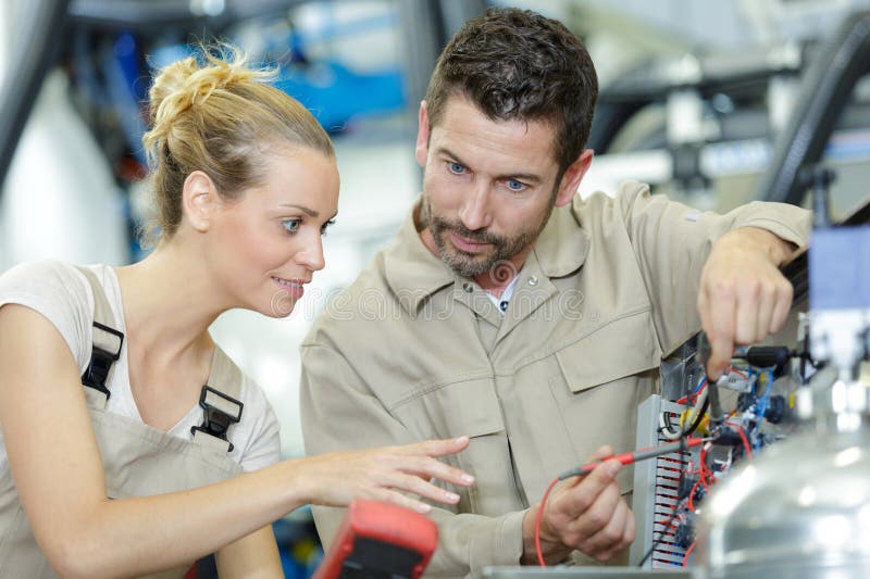 Workers Checking Equipment Cables and Piping Stock Image - Image of ...