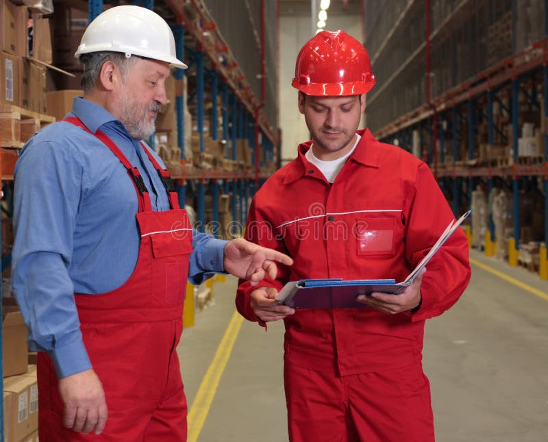 Workers checking invoice stock photo. Image of hardhat - 5562640