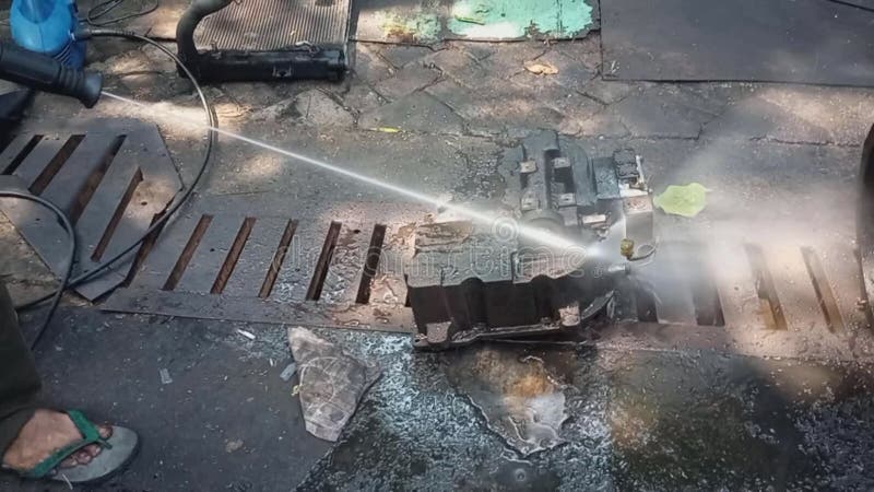 Workers Clean Machines Using High-pressure Water Sprayers Stock Video ...
