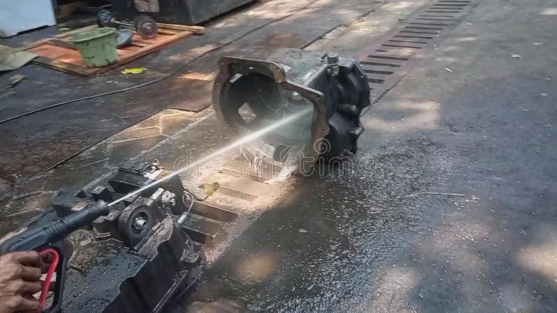 Workers Clean Machines Using High-pressure Water Sprayers Stock Footage ...