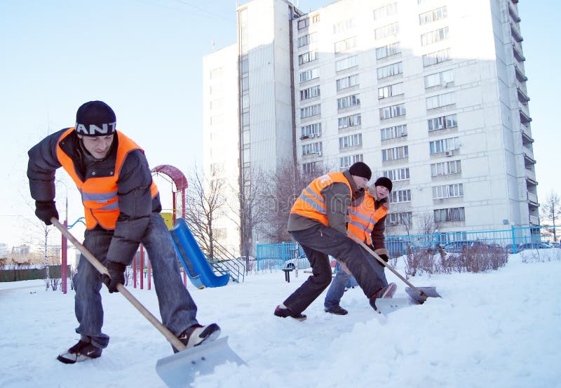 Workers clean snow editorial photo. Image of boot, effort - 23096701