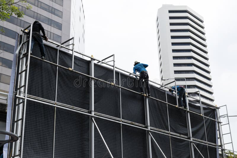 Workers Climb Billboard Structures To Install Billboards Stock Image ...