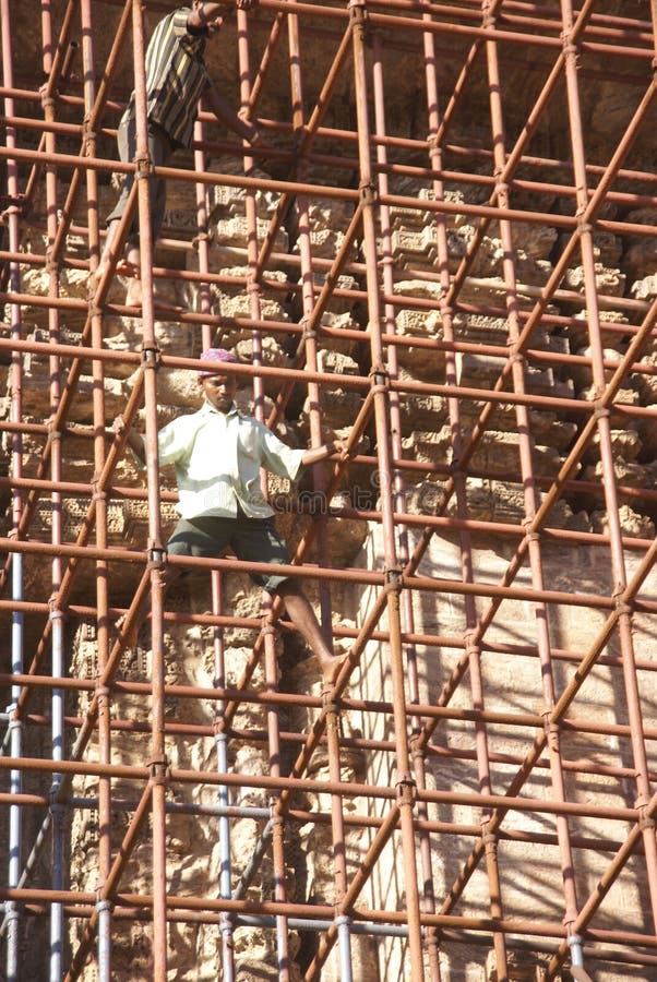Workers Climb Iron Scaffolding Editorial Photo - Image of iron, ladder ...