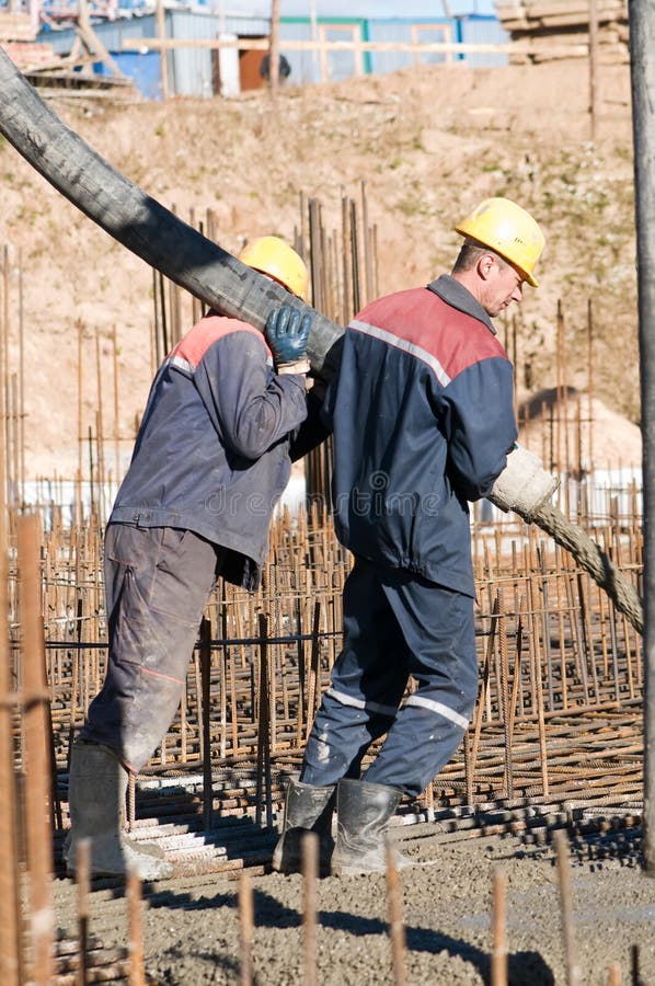 Workers on concrete works stock photo. Image of constructor - 16649058