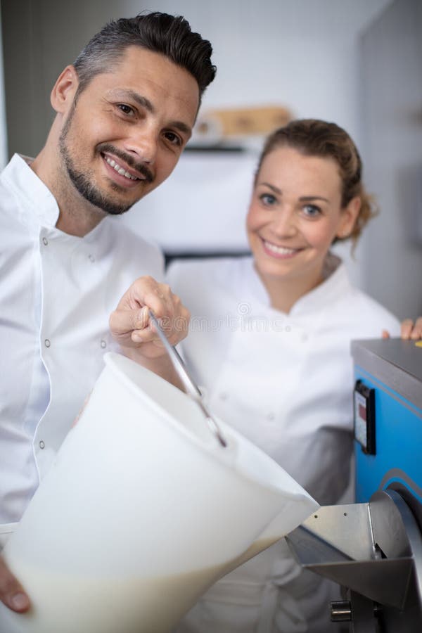 Workers with Cones and Ice Cream at Counter in Parlor Stock Photo ...