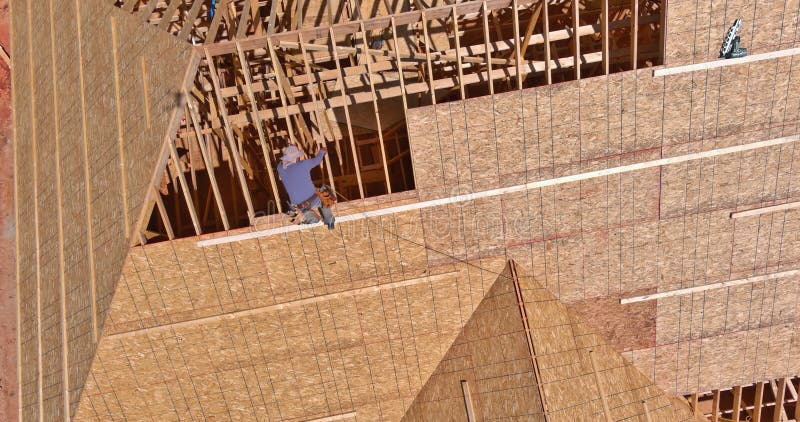 Construction Workers Build Wooden Structure at Residential Site in ...