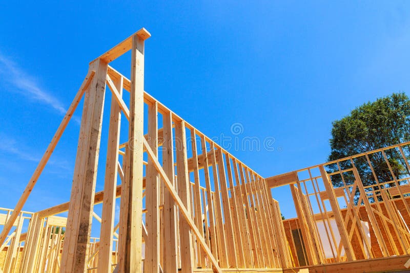 Construction of a Wooden Frame House Under a Clear Blue Sky at Midday ...