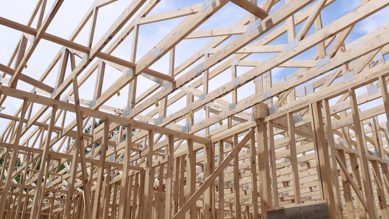 Construction of Wooden Roof Trusses Structure Under Clear Blue Sky in ...