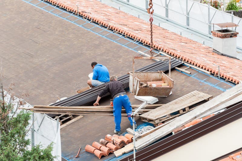 Workers in the Construction of a Roof. Editorial Image - Image of ...