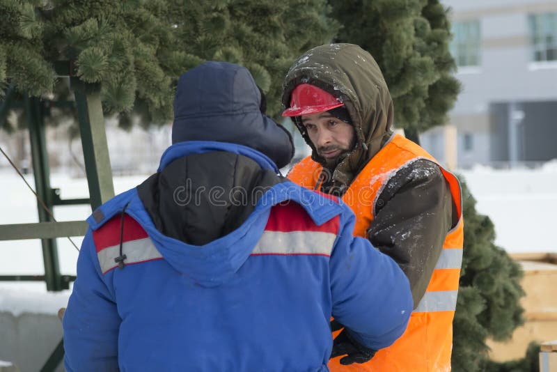 Two Workers Talk on the Assembly Site Stock Image - Image of cold ...