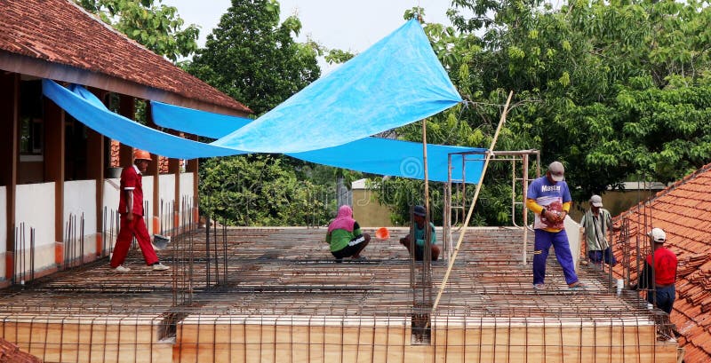 Workers on Construction Site for Multi-storey Housing Block. Editorial ...