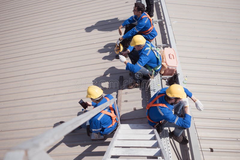 Workers on a Construction Site Take a Break on the Roof Stock Photo ...