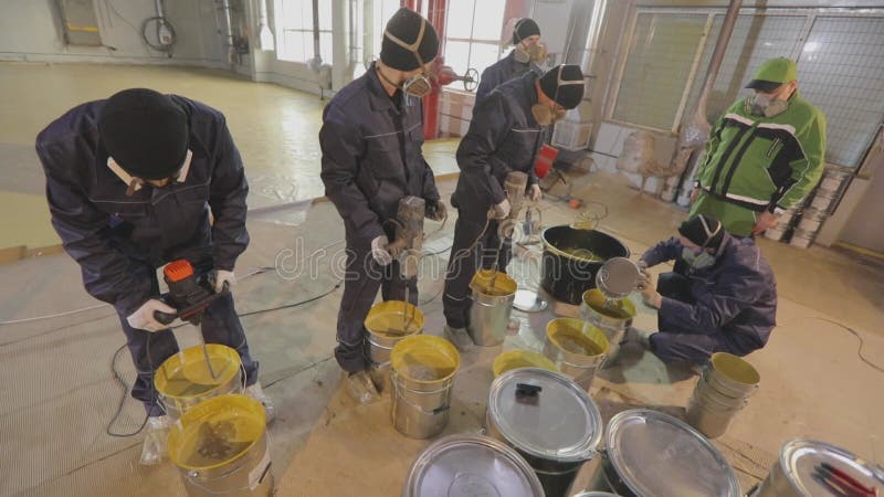 Workers at a Construction Site. Working Process at a Construction Site ...