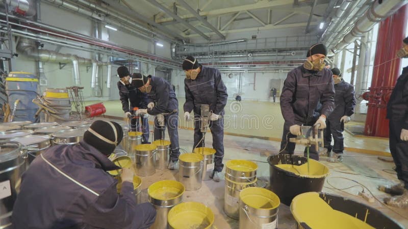 Workers at a Construction Site. Working Process at a Construction Site ...