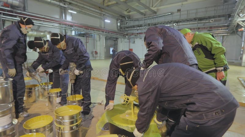 Workers at a Construction Site. Working Process at a Construction Site ...