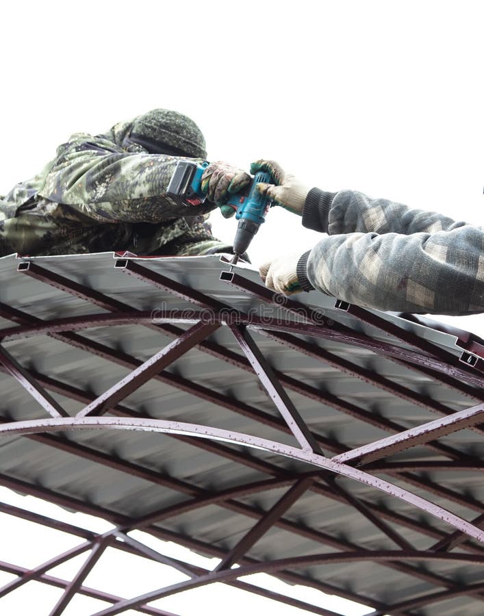 Workers Cover the Canopy with Metal Sheets. Stock Image - Image of ...