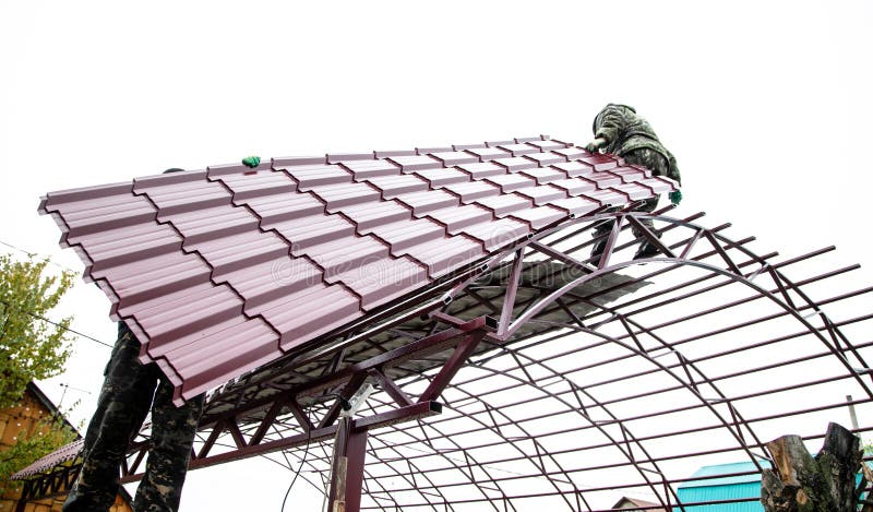 Workers Cover the Canopy with Metal Sheets. Stock Image - Image of ...