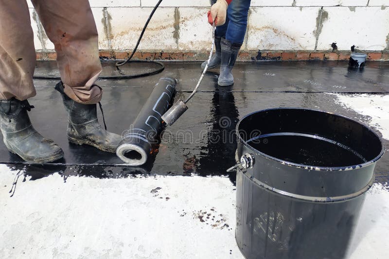 The Workers Cover The Concrete Screed With Bituminous Liquid Solution ...