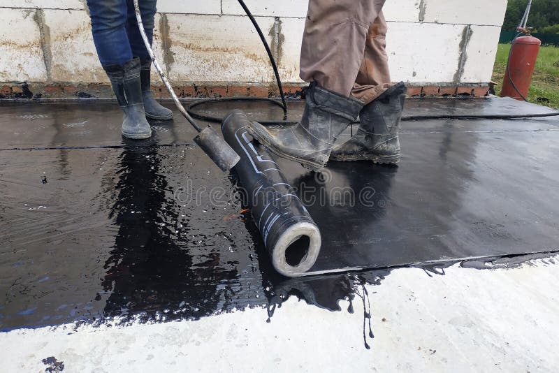 Workers Cover the Concrete Screed with Mortar and Make Waterproofing ...