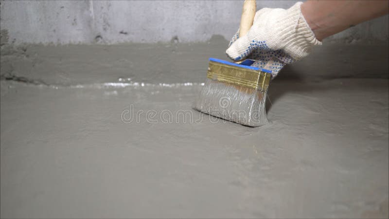 The Process of Applying Mortar - Waterproofing To a Concrete Floor. the ...
