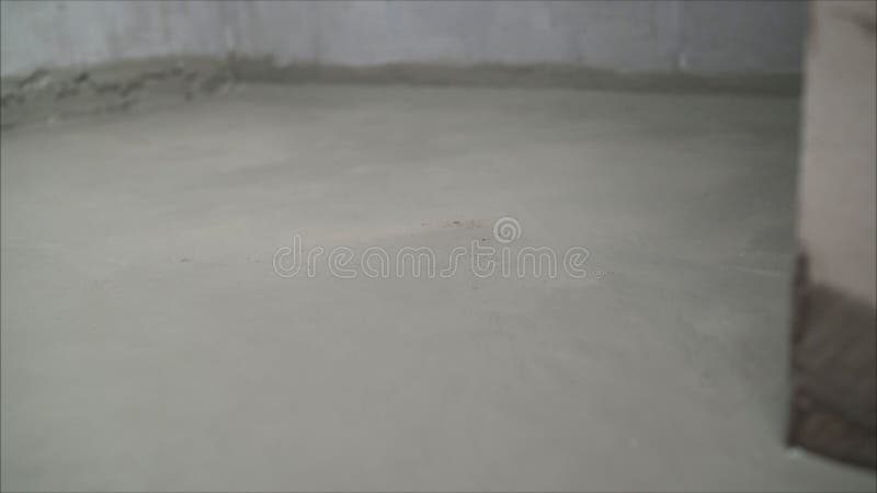 Workers Cover the Concrete Screed with Mortar and Make Waterproofing ...