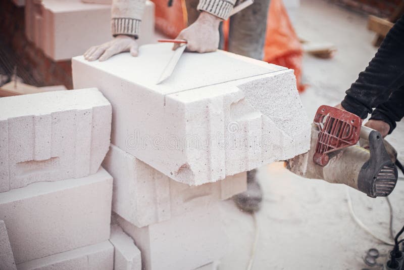 Workers Cutting Autoclaved Aerated Concrete Block with Chainsaw Closeup ...