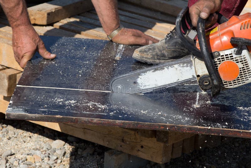 Workers Cutting Plank with Chainsaw Stock Photo - Image of builder ...