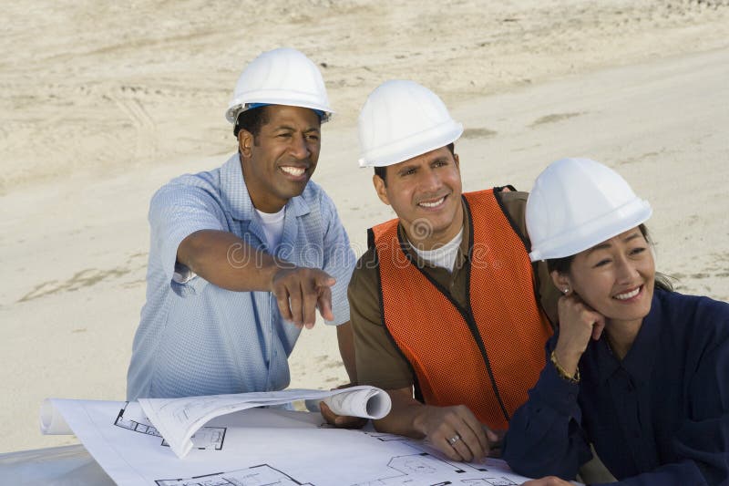 Workers Discussing Development Project Stock Photo - Image of blueprint ...