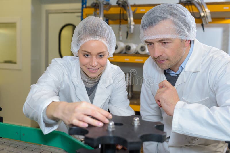 Workers Discussing in Oil Factory Stock Image - Image of coworker ...