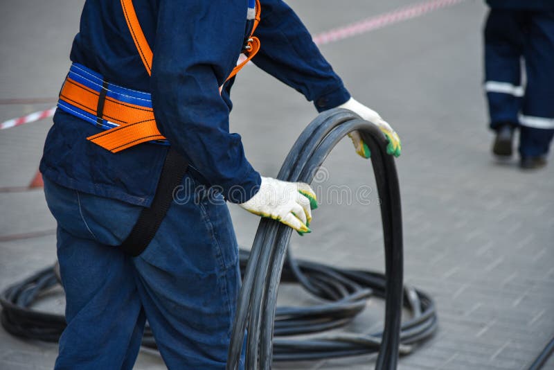 Workers Dismantle the Telecommunication Cable in the Well Stock Image ...