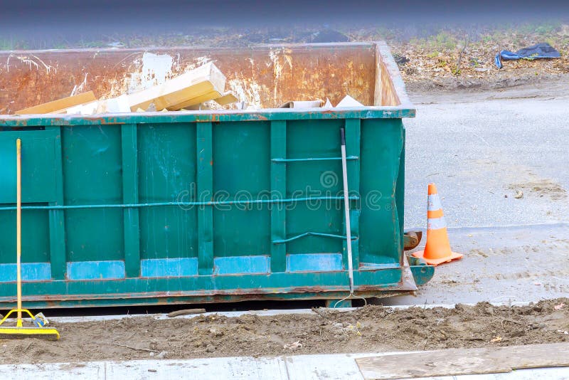 Construction Site Waste Container Filled with Debris on Suburban Street ...