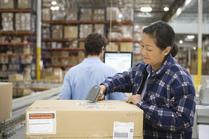 Person at Computer Terminal in Distribution Warehouse Stock Image ...