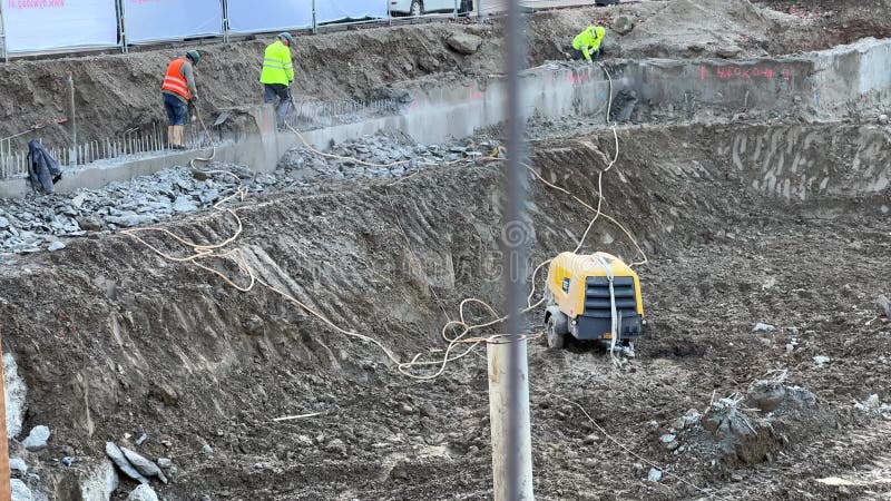 Workers Doing Compressor Work at Construction Pit Stock Video - Video ...