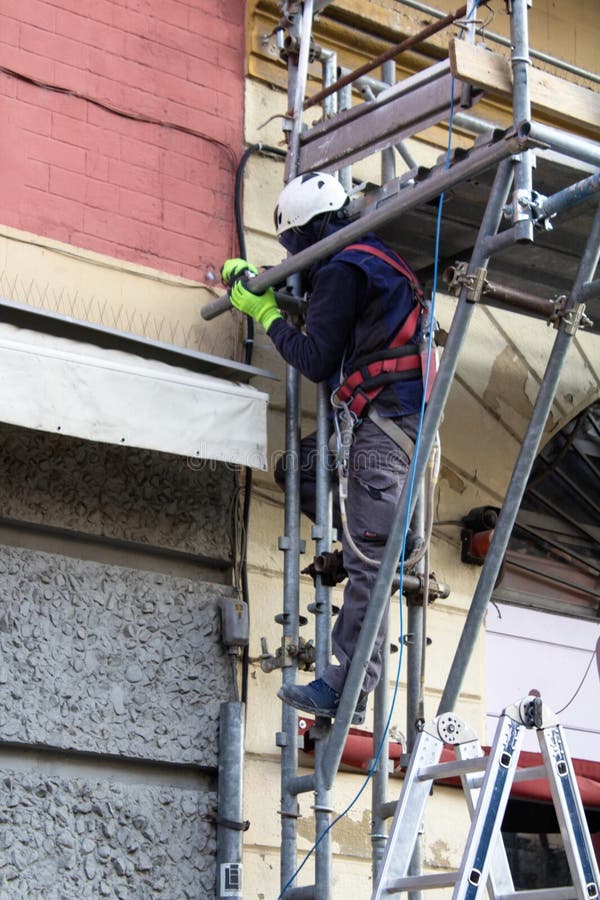 Workers Engaged in Assembling a Scaffolding Stock Photo - Image of buoy ...