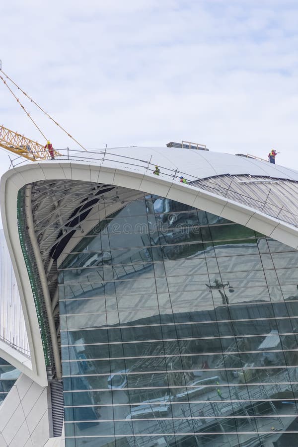 Workers are Engaged in the Installation of the Roof on a High-rise ...