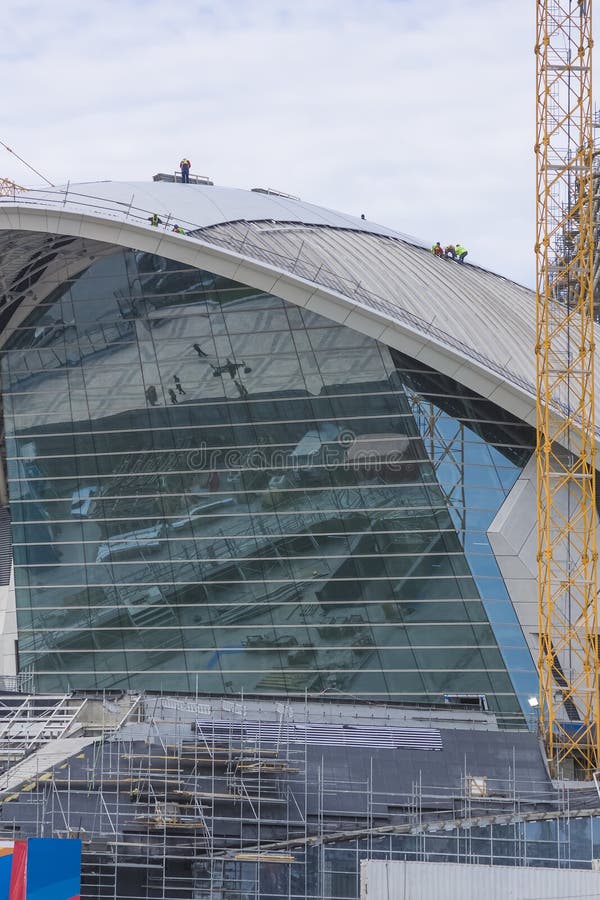 Workers are Engaged in the Installation of the Roof on a High-rise ...