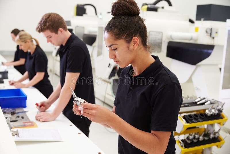 Factory Workers Checking Goods on Production Line Stock Image - Image ...