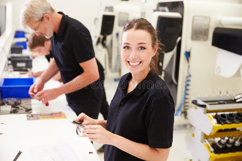 Factory Workers Checking Goods on Production Line Stock Image - Image ...