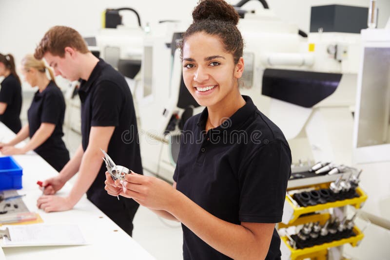 Factory Workers Checking Goods on Production Line Stock Image - Image ...
