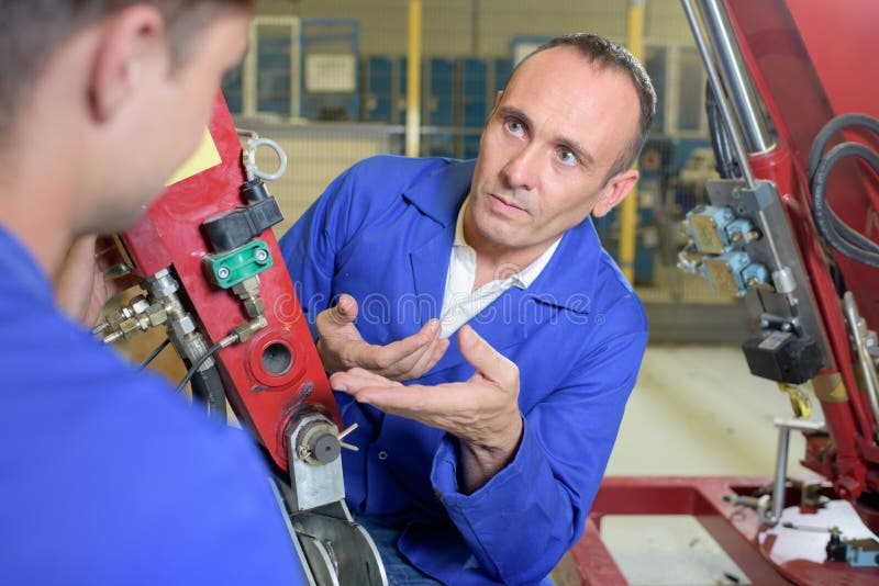 Workers and Factory Apprentice Fixing Machine Stock Photo - Image of ...