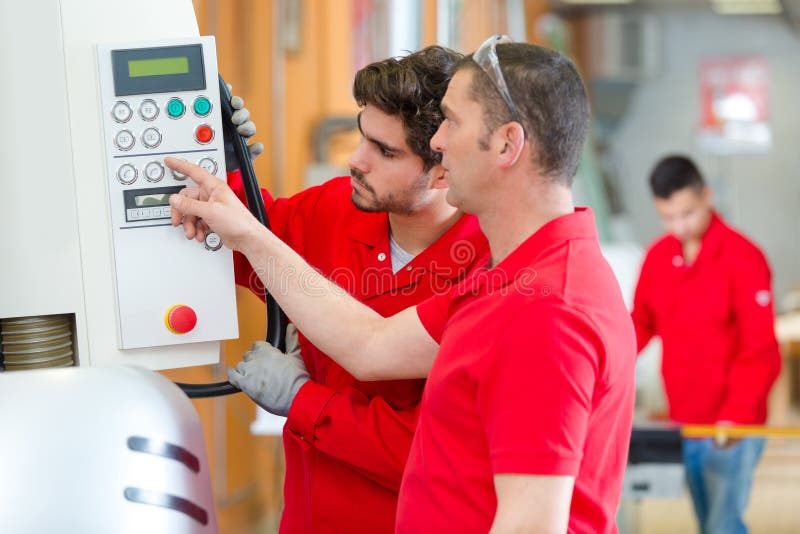Workers in Factory on Machine Stock Photo - Image of middle ...