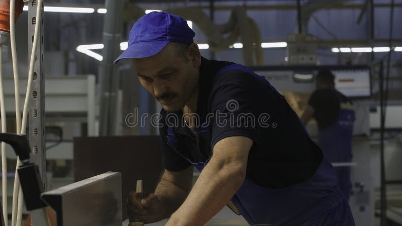 Workers at Factory with Machines. Creative. Workers are Engaged in ...