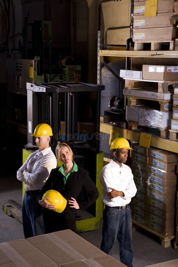 Workers with Female Boss in Storage Warehouse Stock Photo - Image of ...